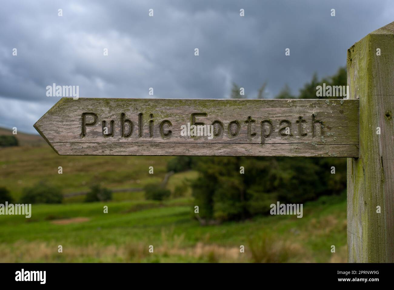 Wooden signpost "Public Footpath" in the Deepdale in the Yorkshire ...