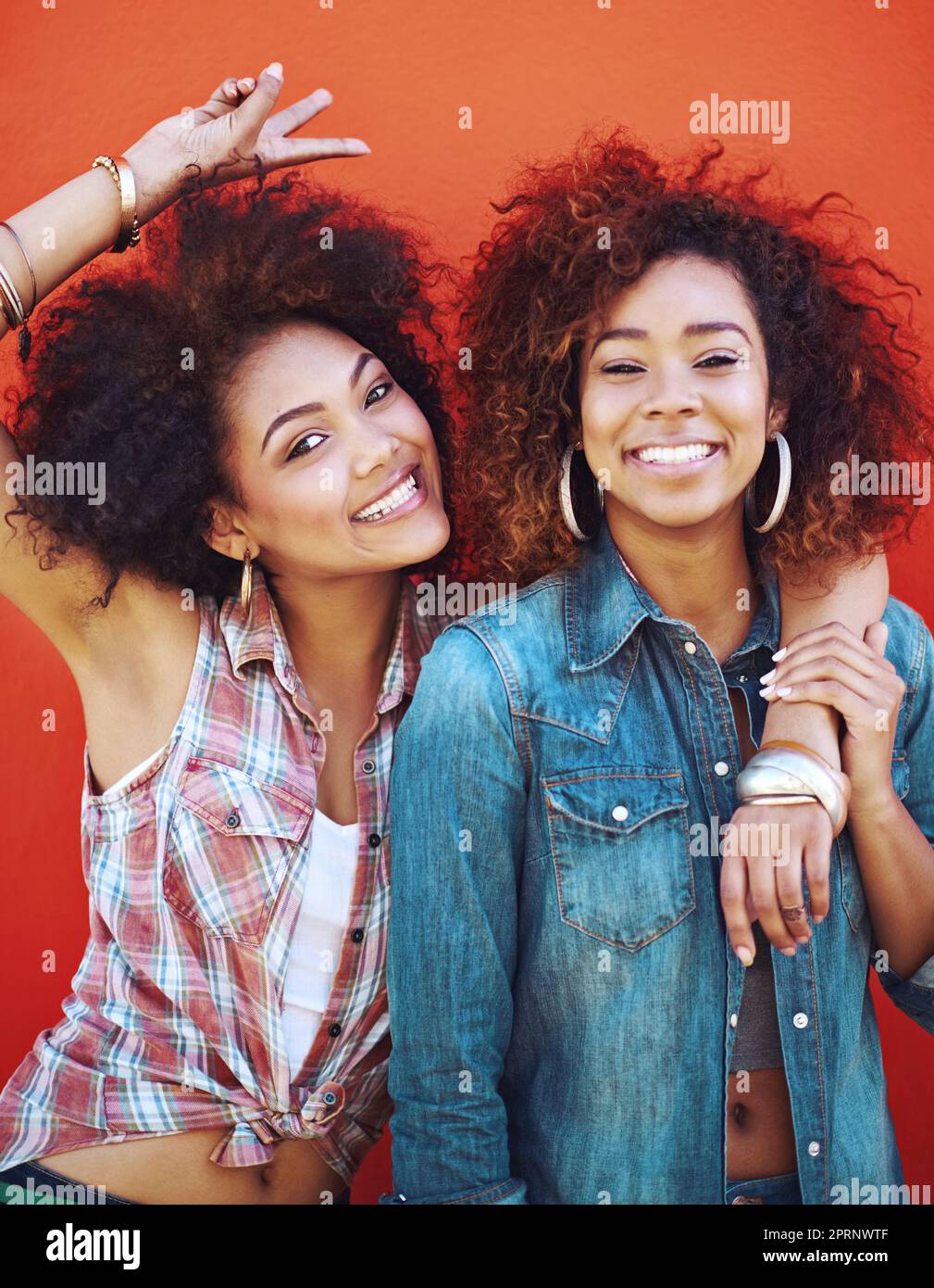 Best friends have double the fun. two young friends posing against a ... Best friends have double the fun. two young friends posing against a ...