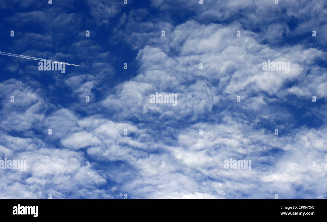 A jet flies into the ice clouds Stock Photo - Alamy