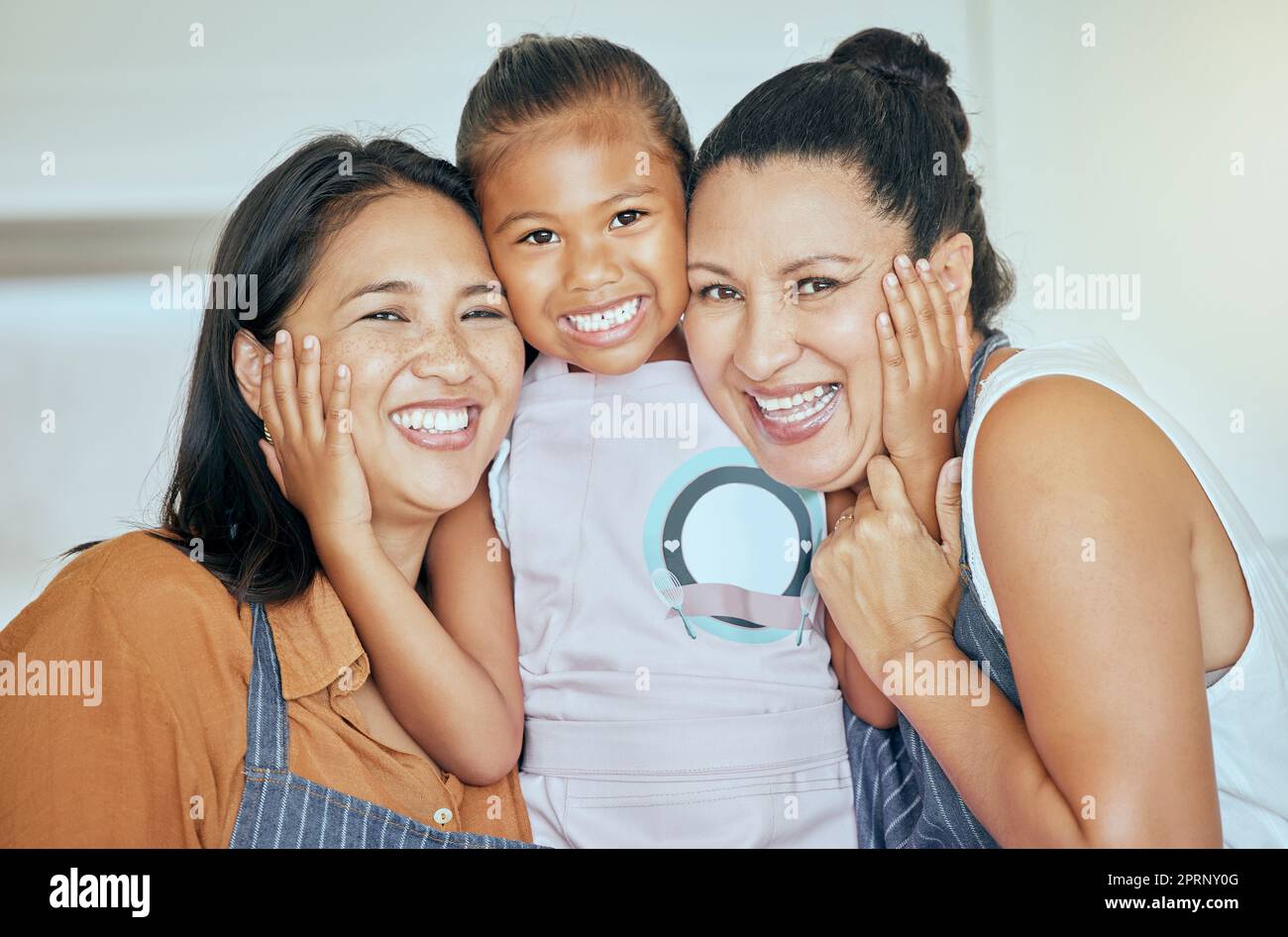 Mother, grandmother and child in apron, hug and cooking together in ...