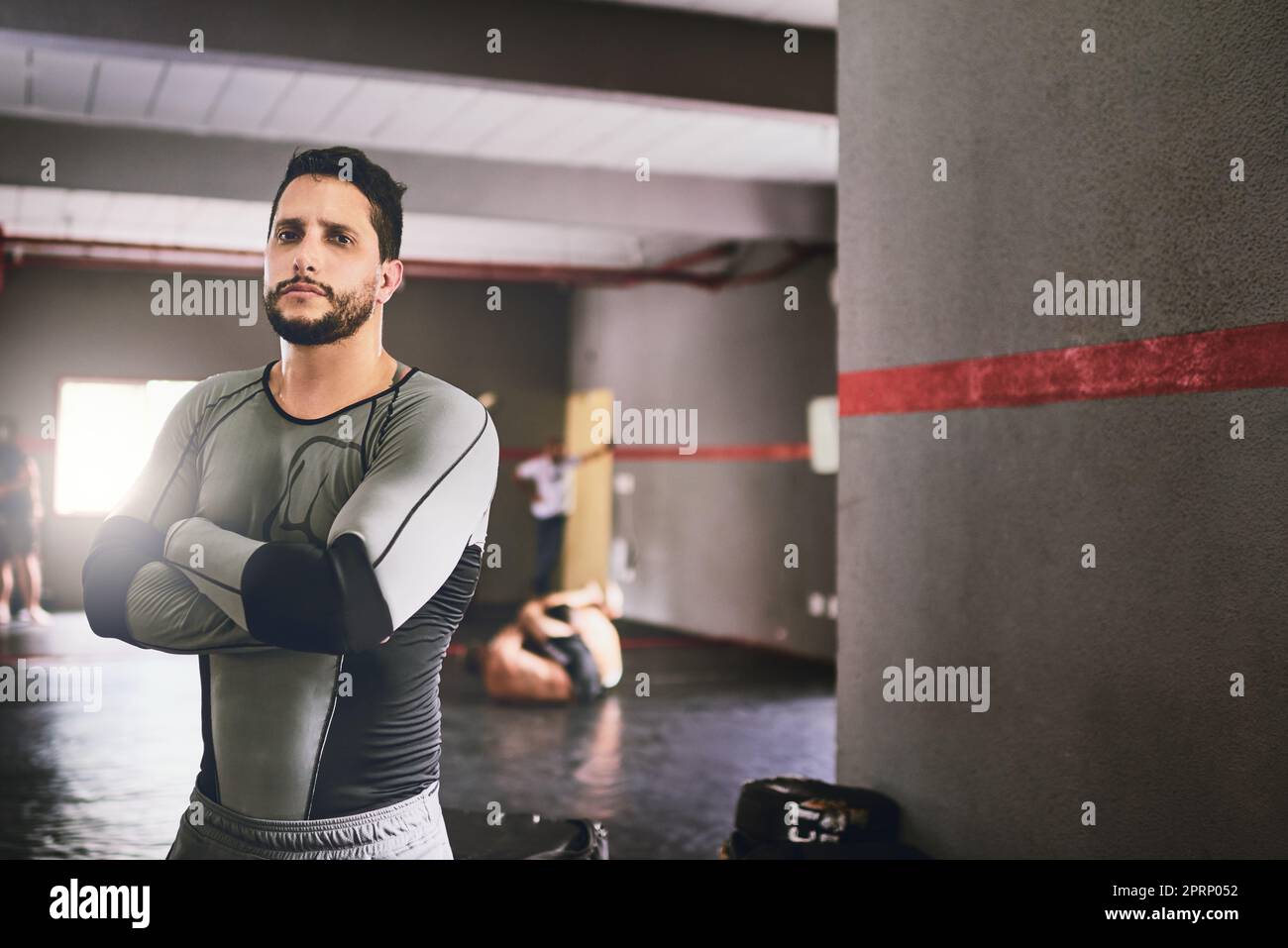 He is king of the ring. Portrait of a confident young male boxer ...