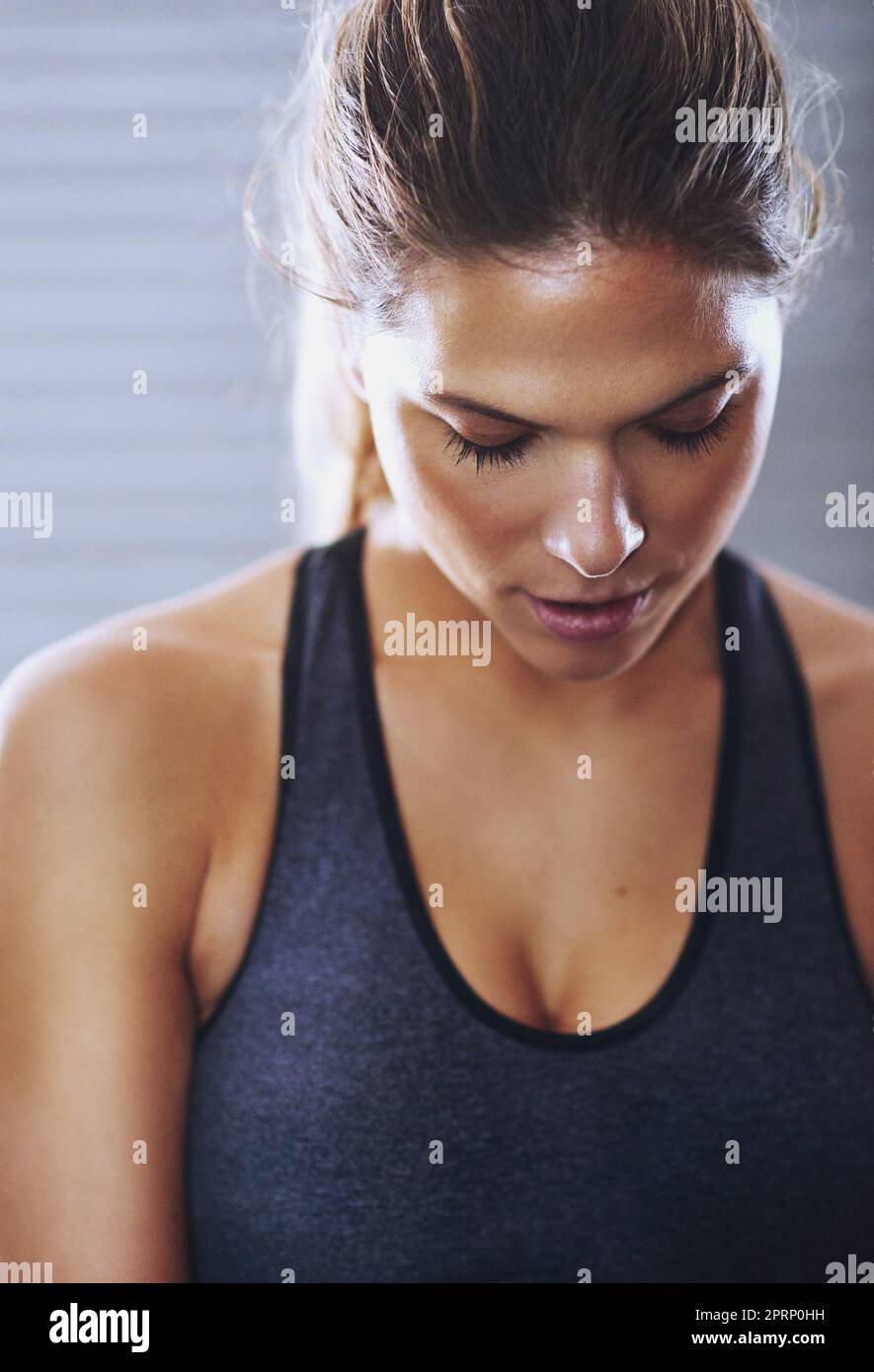 Getting psyched for her workout. a fit young woman at the gym Stock ...