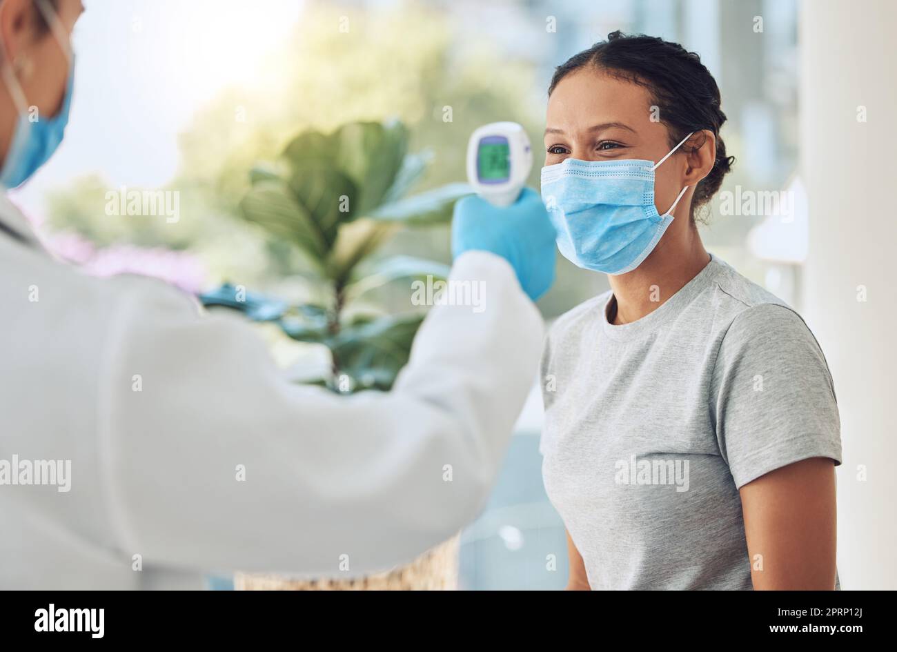 Covid, mask and doctor thermometer test with patient for virus scan ...