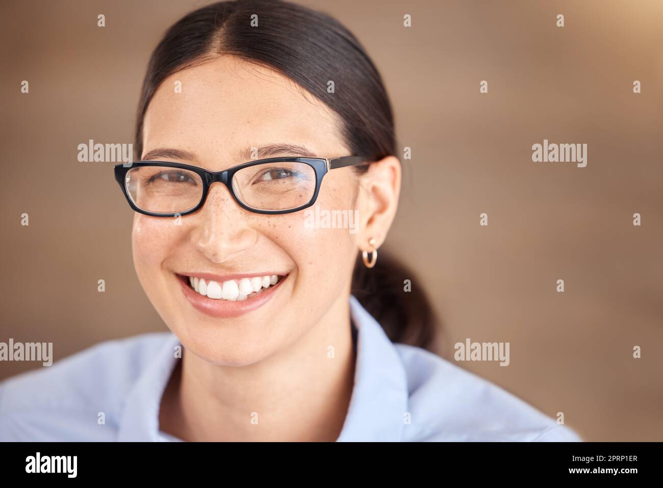 Face, eyes and vision with a woman with glasses with a smile while ...