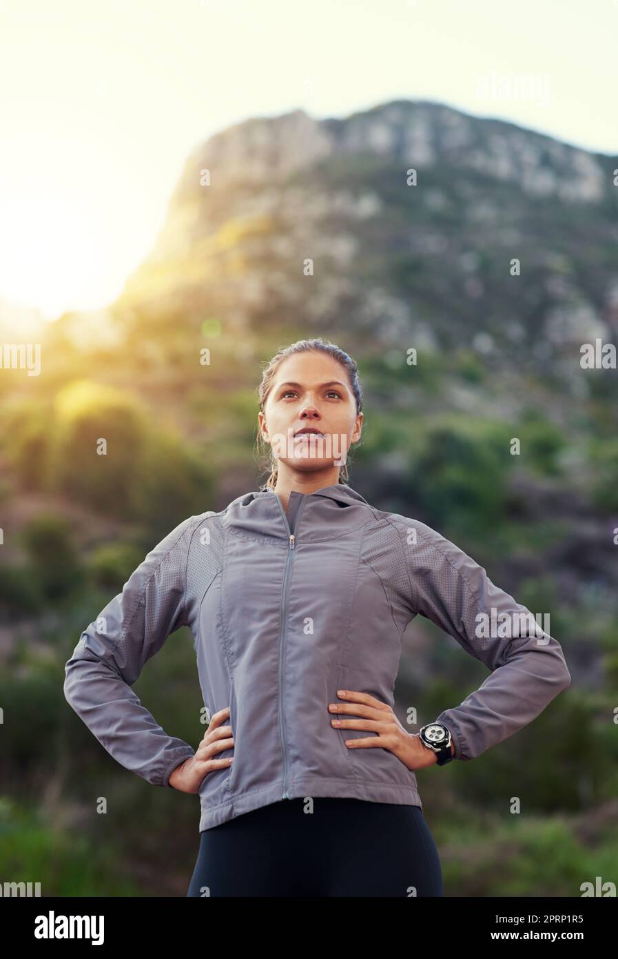 Theres always one more peak. a young woman out for a trail run Stock ...