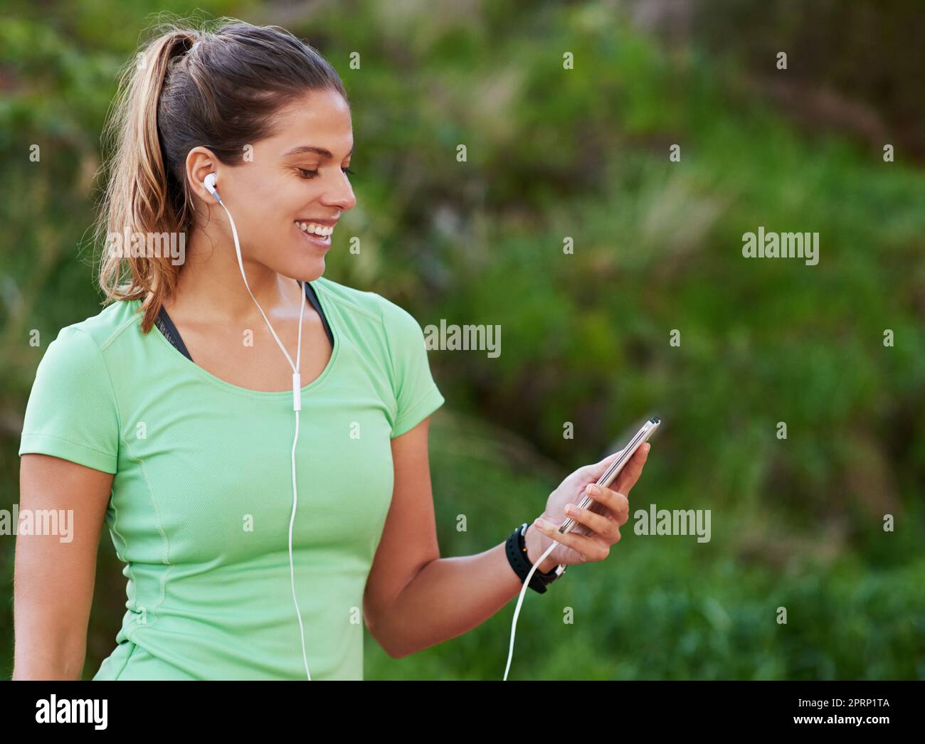 Getting into the zone with her favorite music. a young woman listening ...