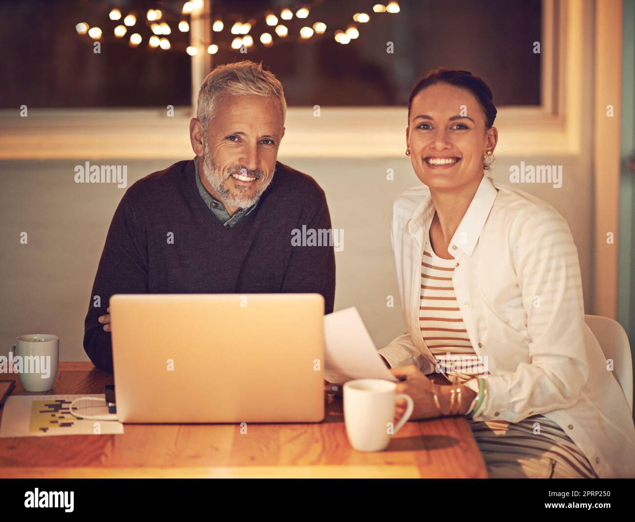 Success Is Worth All The Late Nights Cropped Portrait Of Two Colleagues Working Late At The