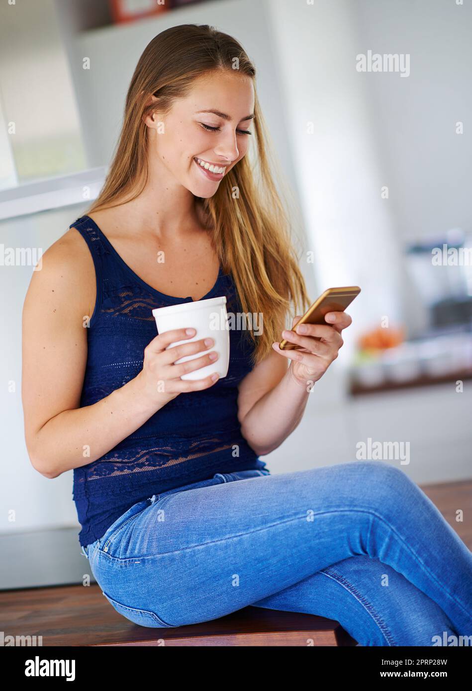 Woman sitting on kitchen counter hi-res stock photography and images ...