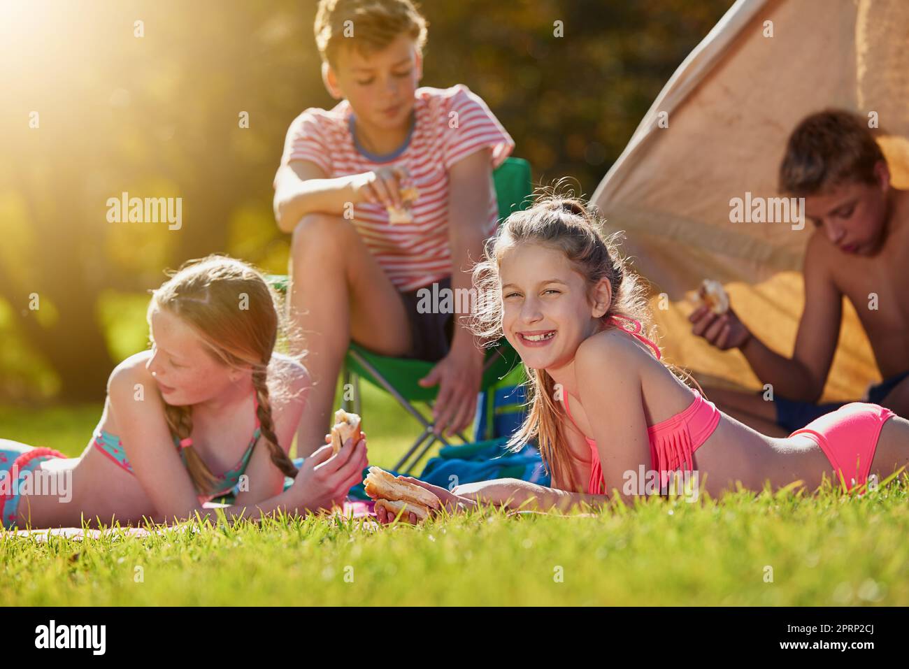 Lazy summer days with my friends. a group of young friends hanging out ...