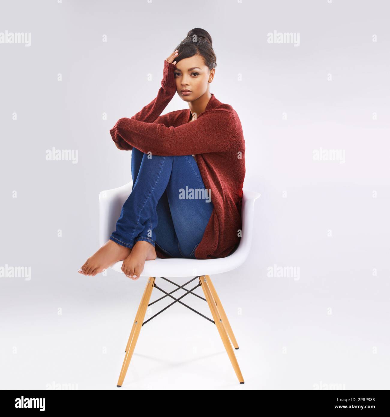 Own you style. Studio portrait of an attractive young woman sitting on ...