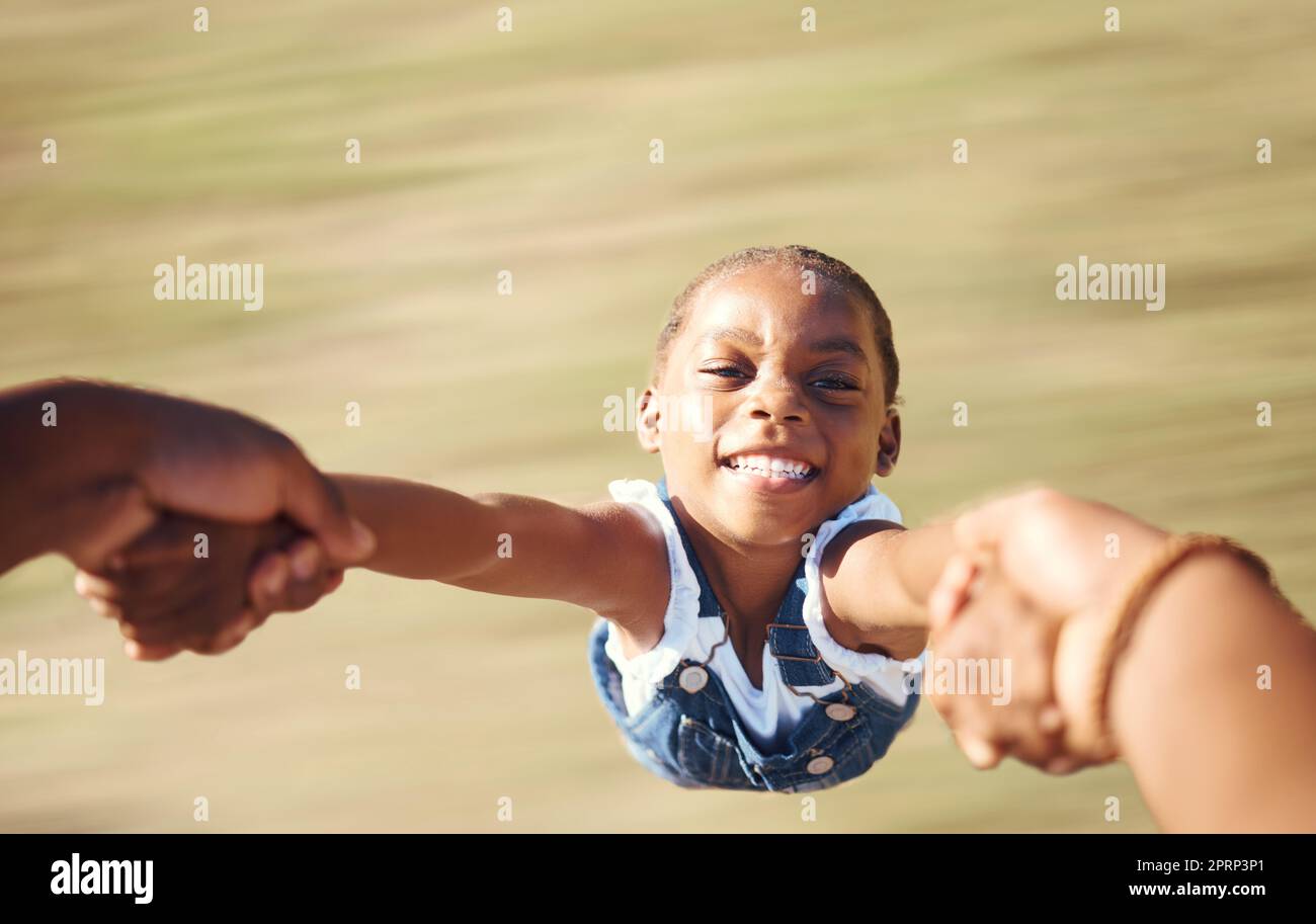 Pov, mother spinning girl and holding hands at park, in nature or ...