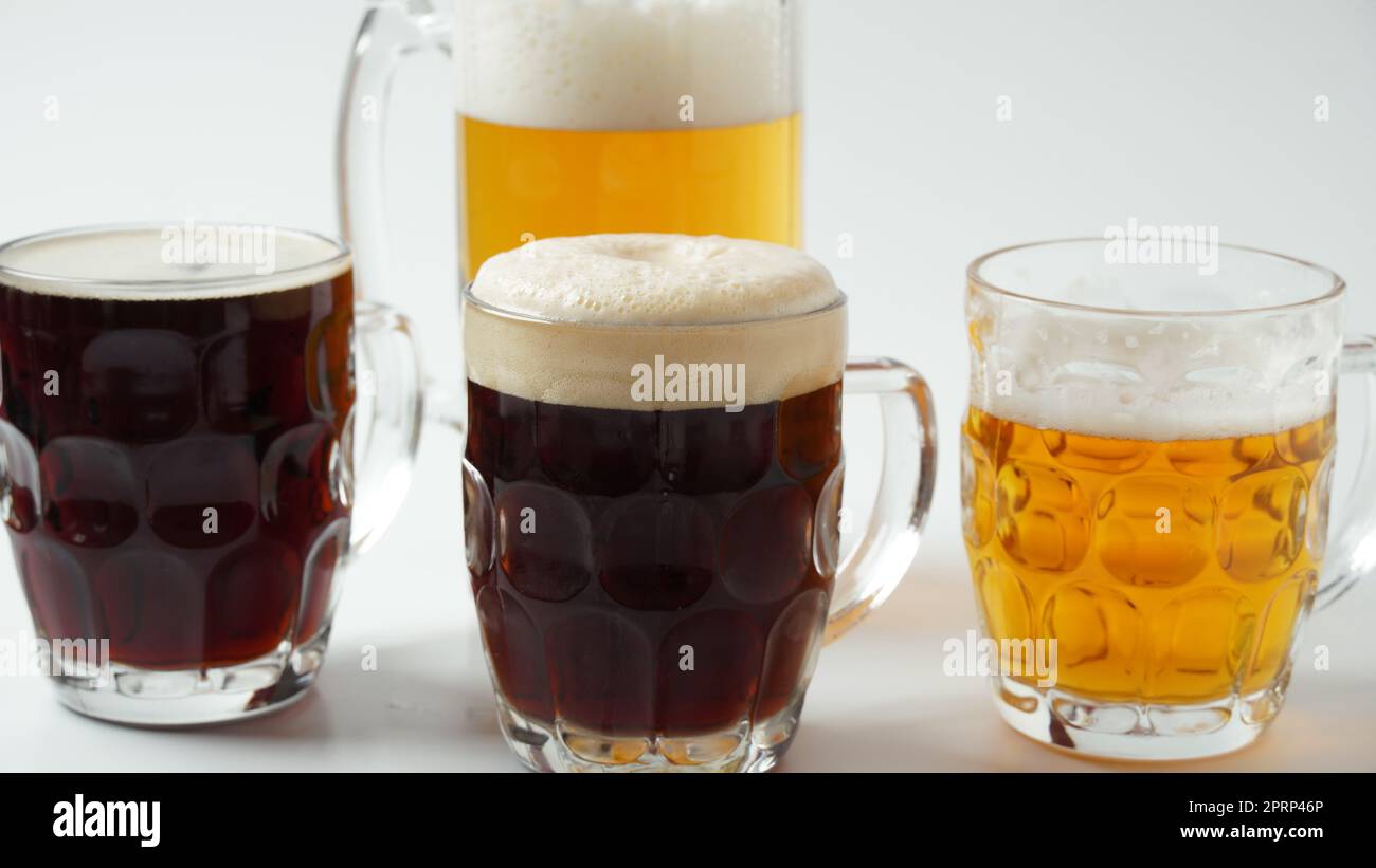 Mugs of beer different flavor - light, dark, and red Stock Photo - Alamy