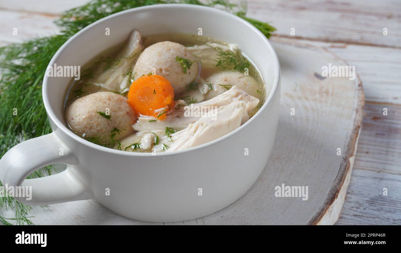 Chicken Matzo ball soup with carrots in the bowl. Jewish traditional ...