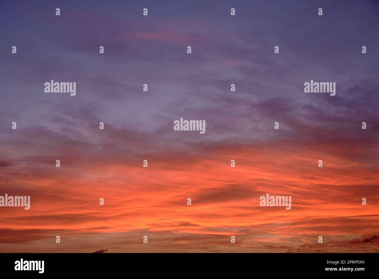 Sky light after sunset. orange background, clouds Stock Photo - Alamy