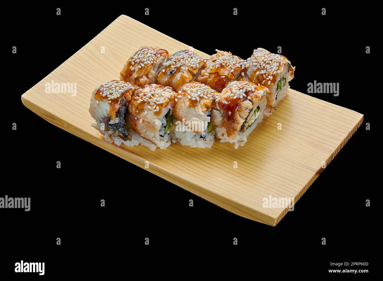 delicious Canada rolls on a wooden stand on a black isolated background ...