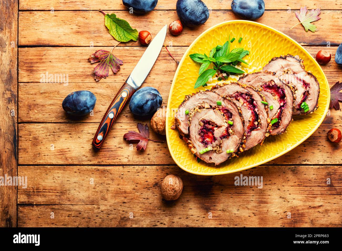 Meat roll with plum Stock Photo - Alamy