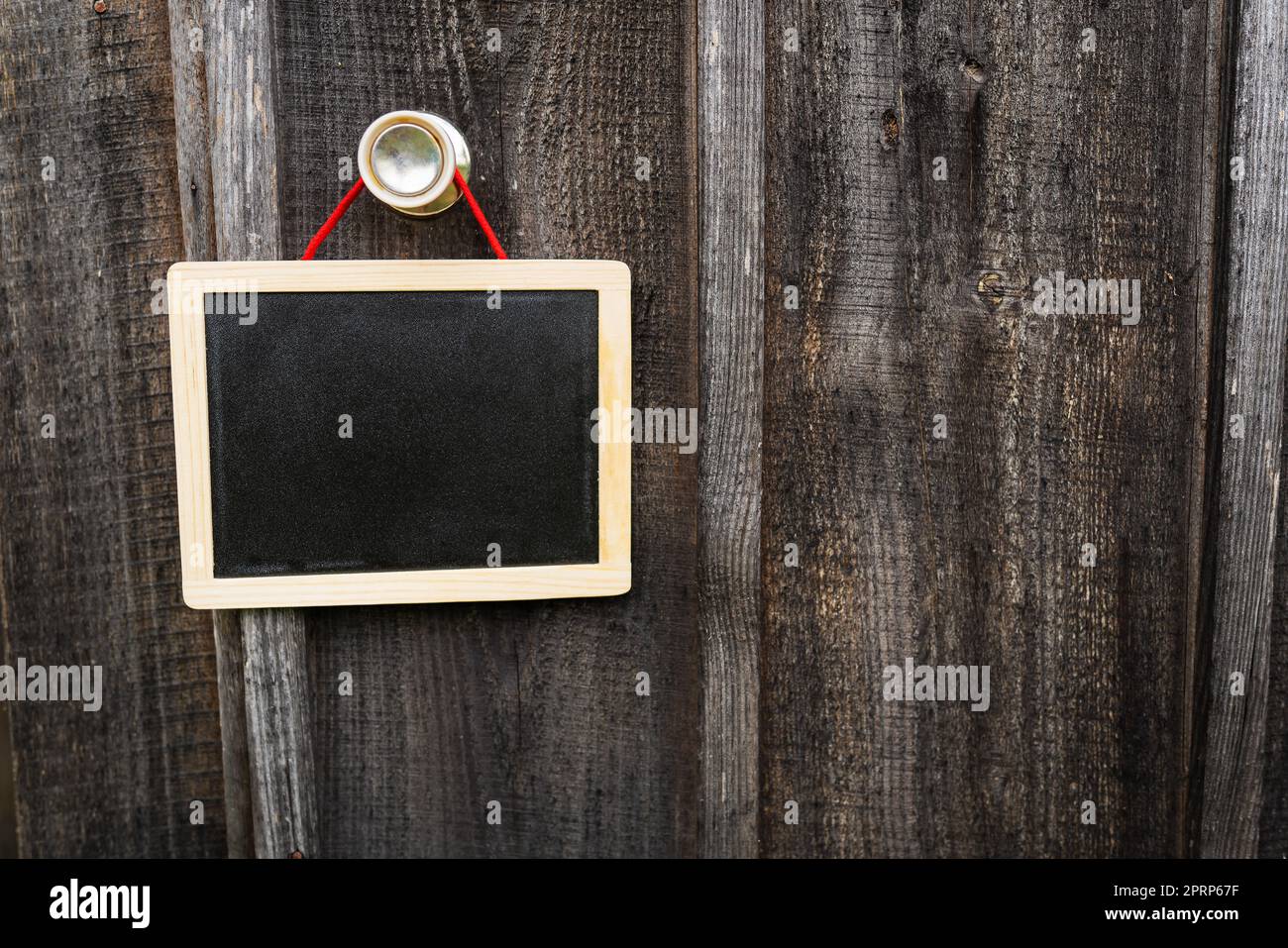 A small graphite note board on a wooden background, a note board, a ...