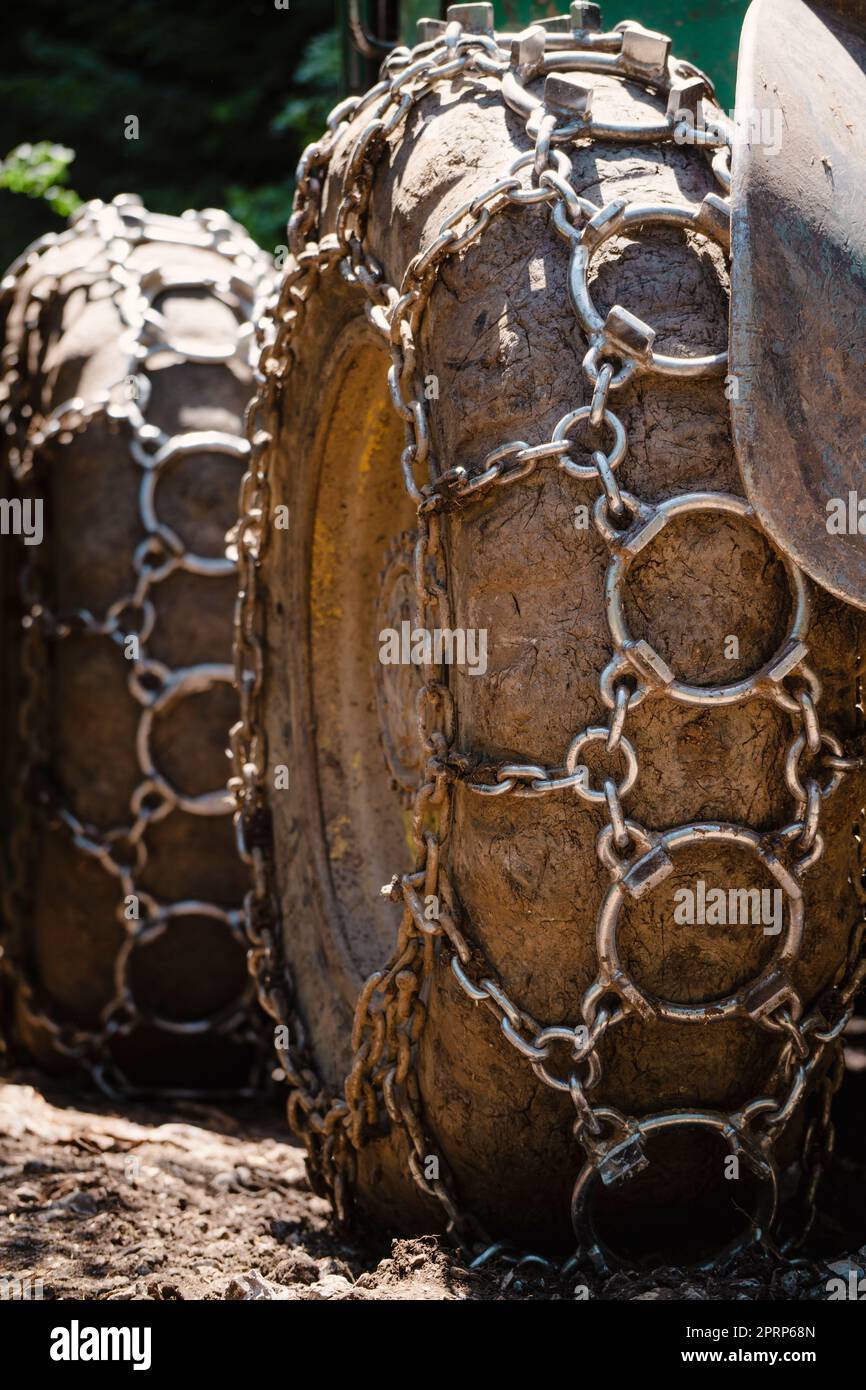 Traction chains on the big wheel of a forest log truck Stock Photo - Alamy