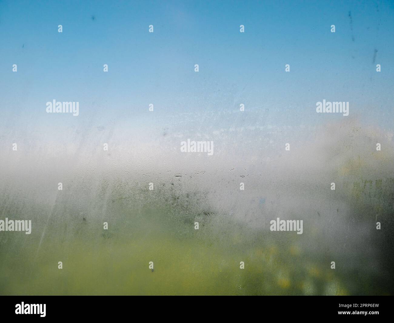 Water drops and condensed stem on glass at summer sunny day ...