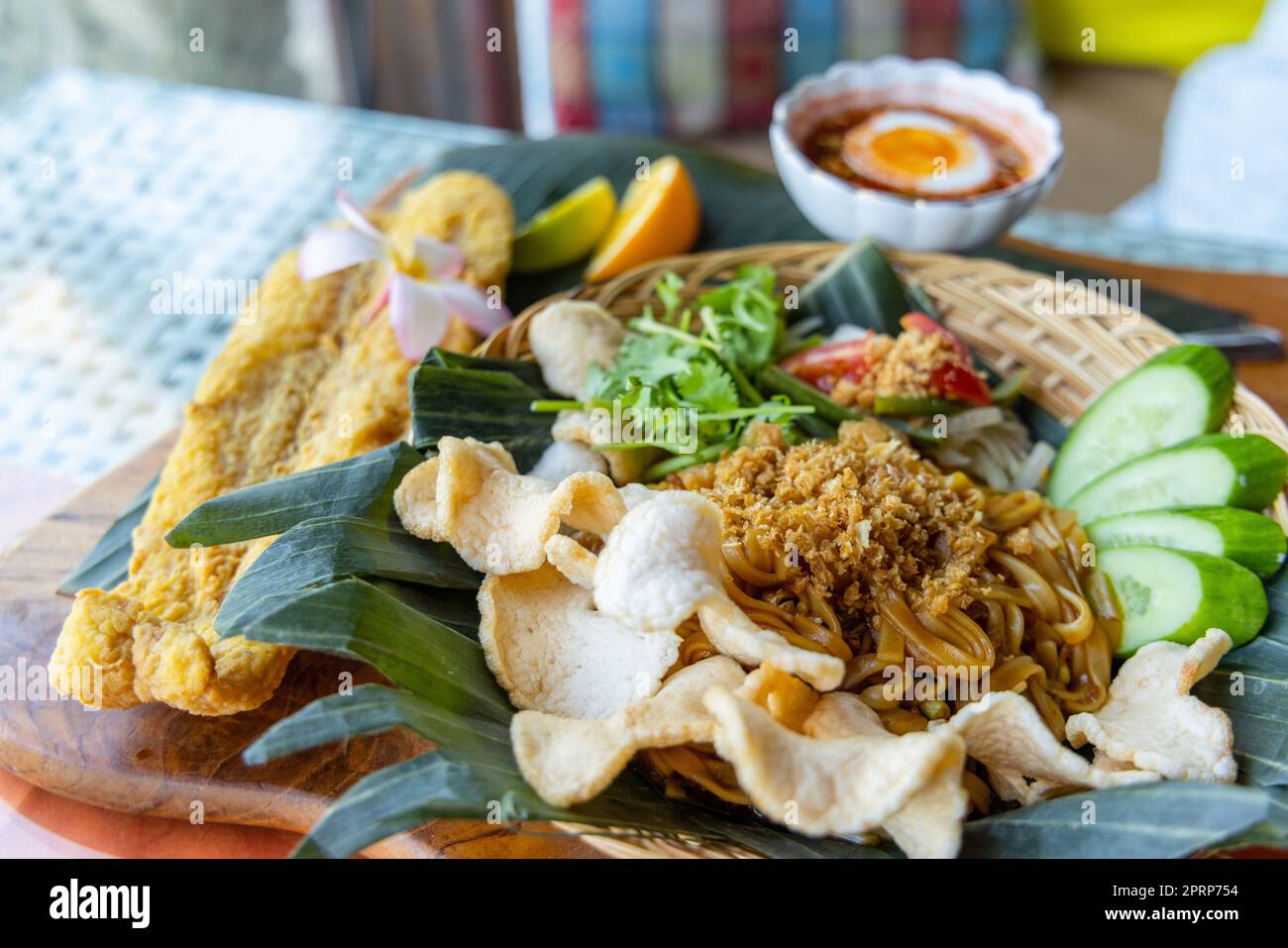 Thai cuisine, crispy fish fillet and pad thai Stock Photo - Alamy
