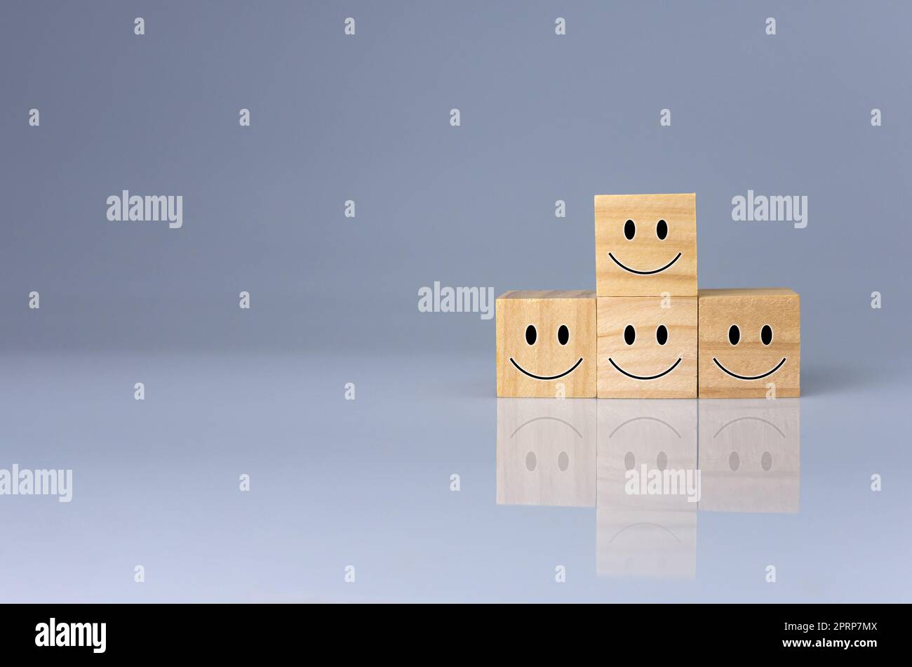 Smiles on the cube. It represents positive ratings, feedback and ...