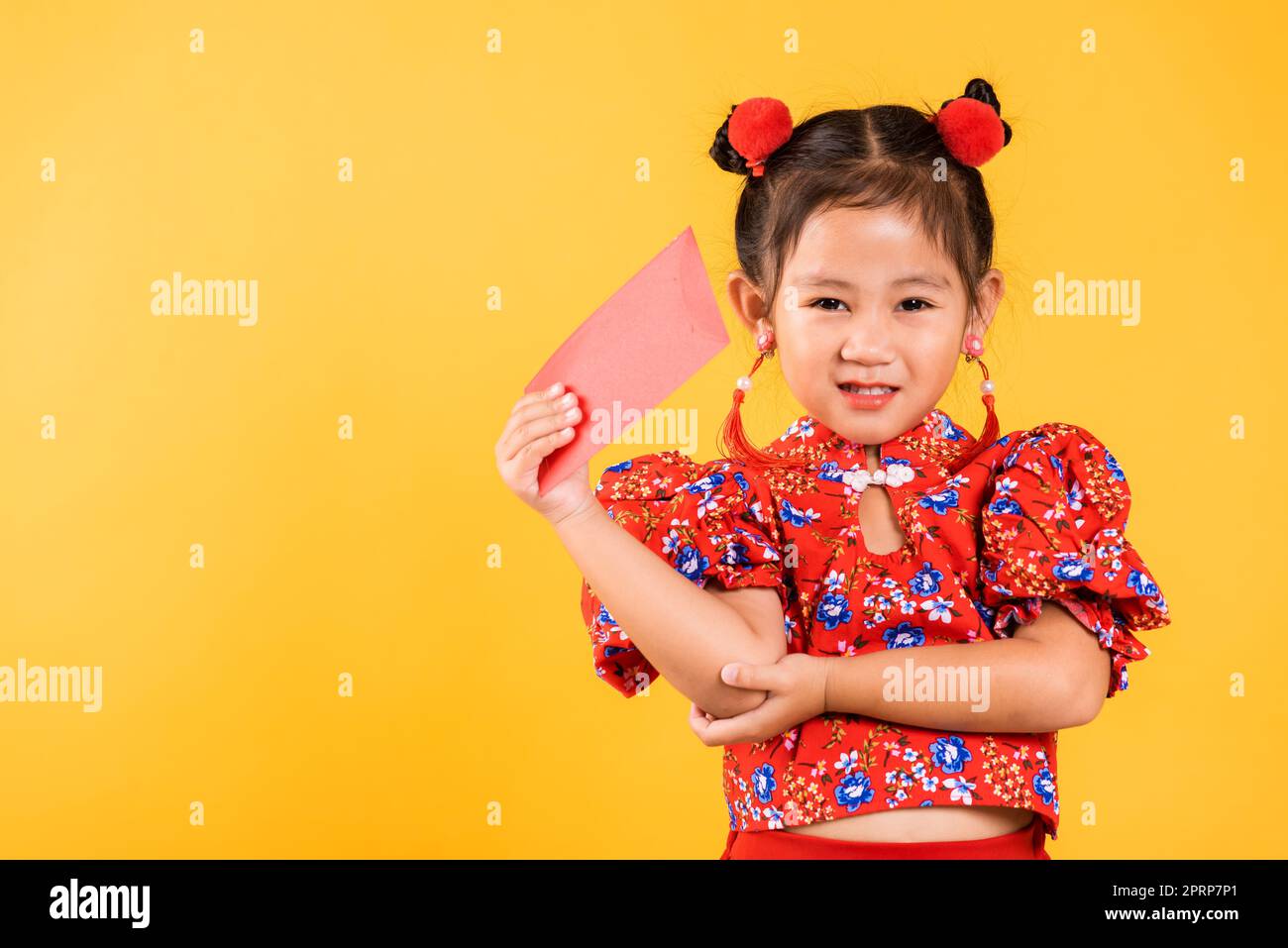 Chinese New Year. Happy Asian Chinese little girl smile wear red ...