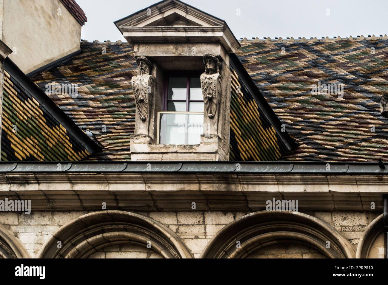 Classical building with multicoloured roof tiles, Dijon, France Stock ...