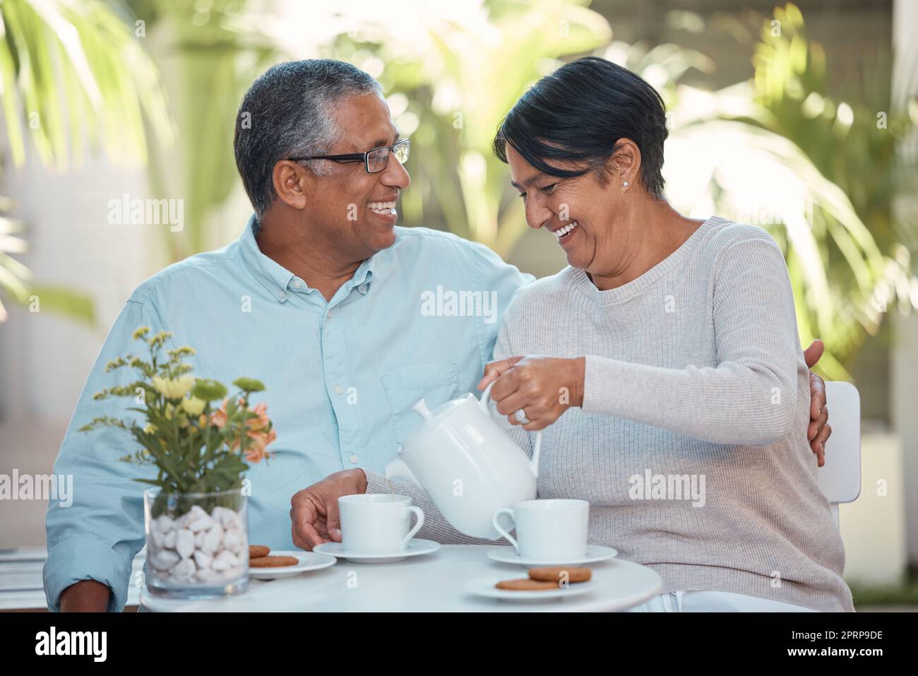 Garden tea in home, senior happy couple talking together in backyard ...