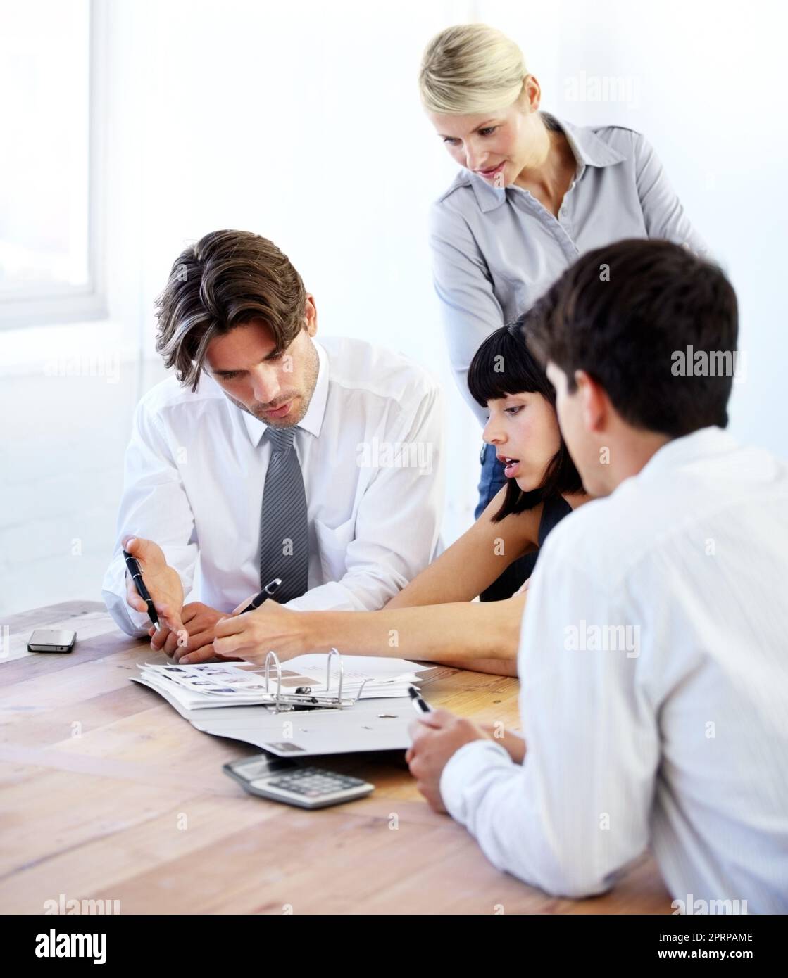 Creative minds at work. Group of businesspeople working together as a ...