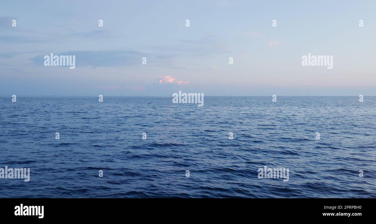 Sea and the sky under sunset Stock Photo - Alamy