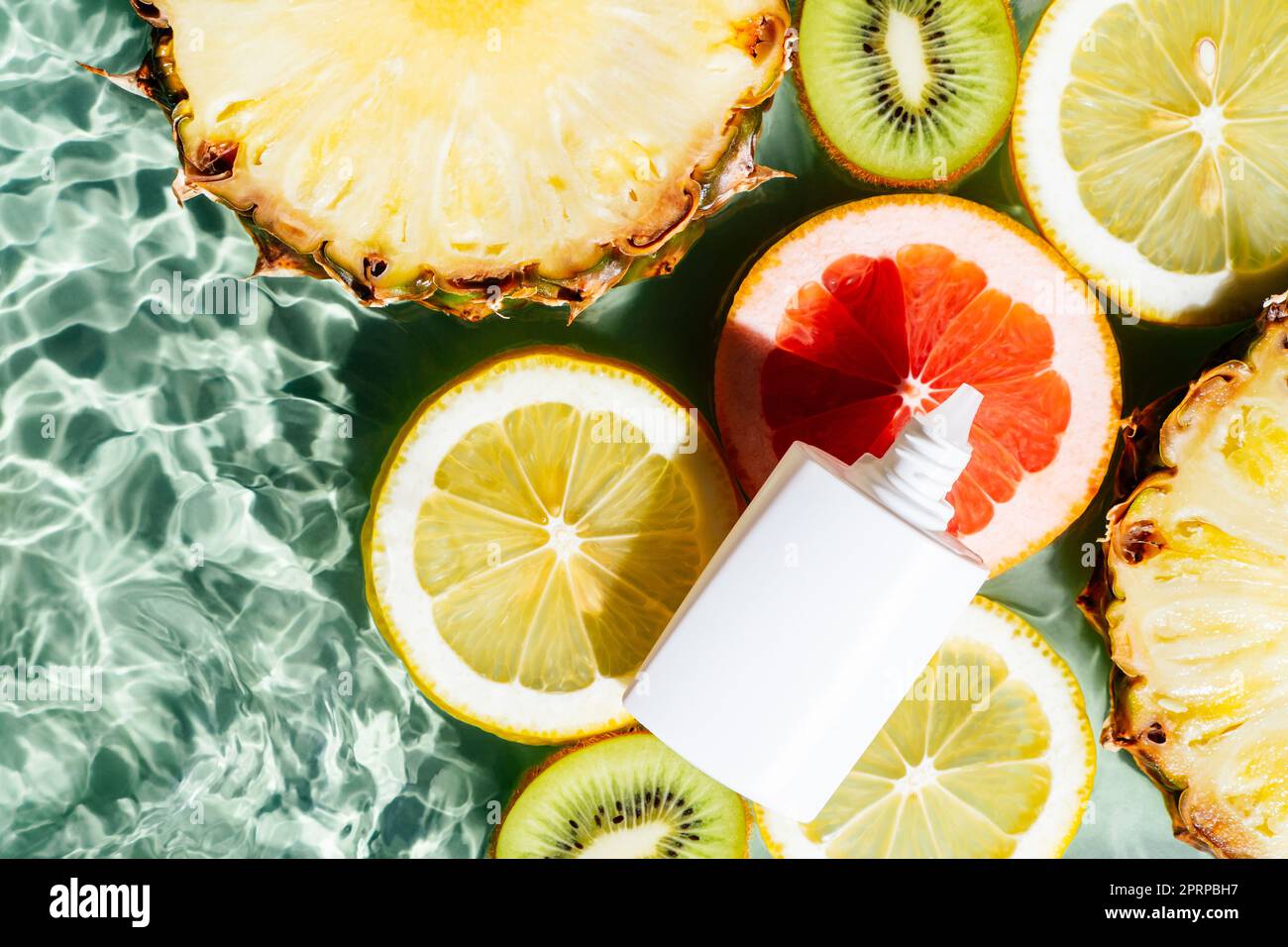 White beauty product sunscreen cream vial tube bottle with fruit citrus ...