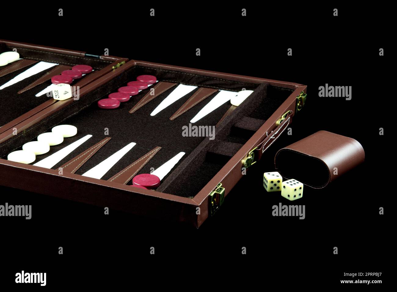 Backgammon game isolated on a black table top Stock Photo - Alamy