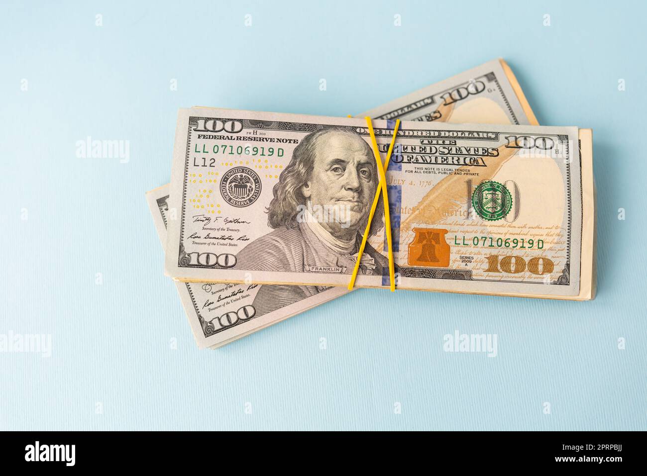 Dollar bills tied rubber band hi-res stock photography and images - Alamy
