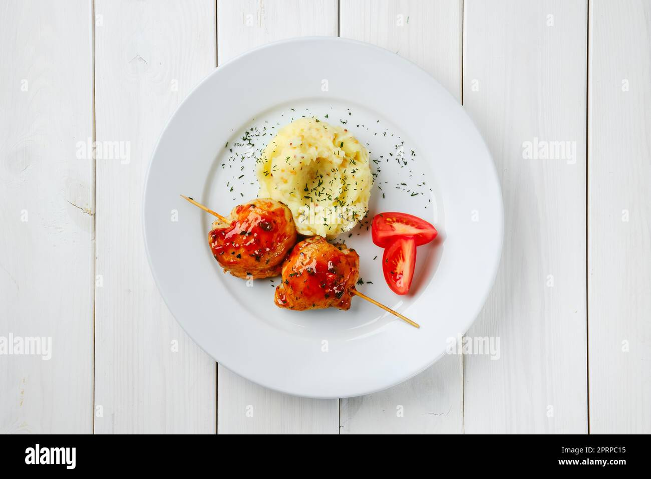 Top view of roasted chicken fillet on skewer with barbecue sauce and ...