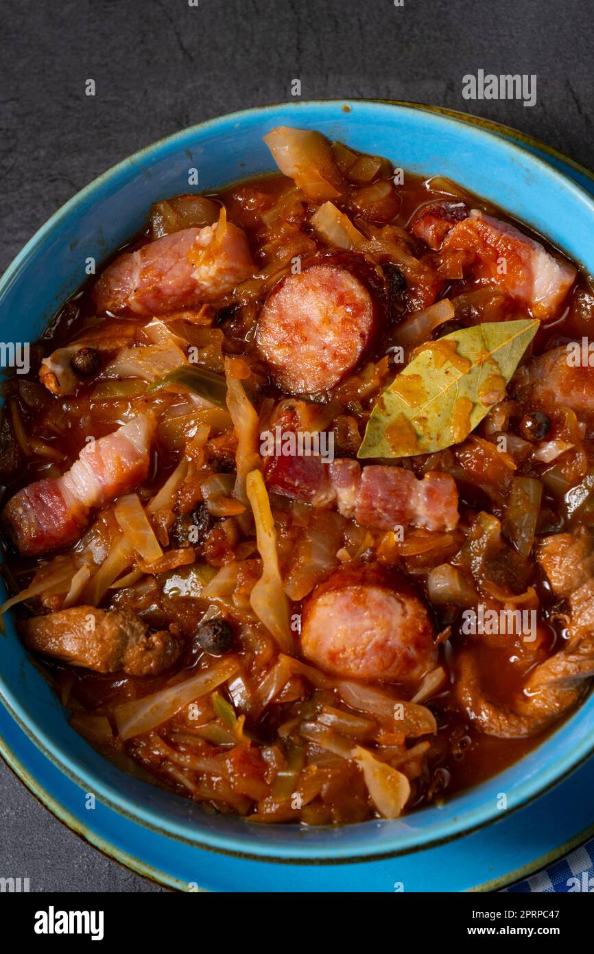 Polish bigos with sausage and mushrooms Stock Photo - Alamy