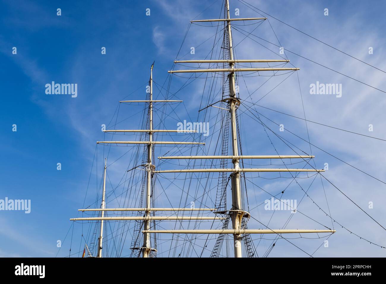 Sailing ship mast against the blue sky on some sailing boats with ...