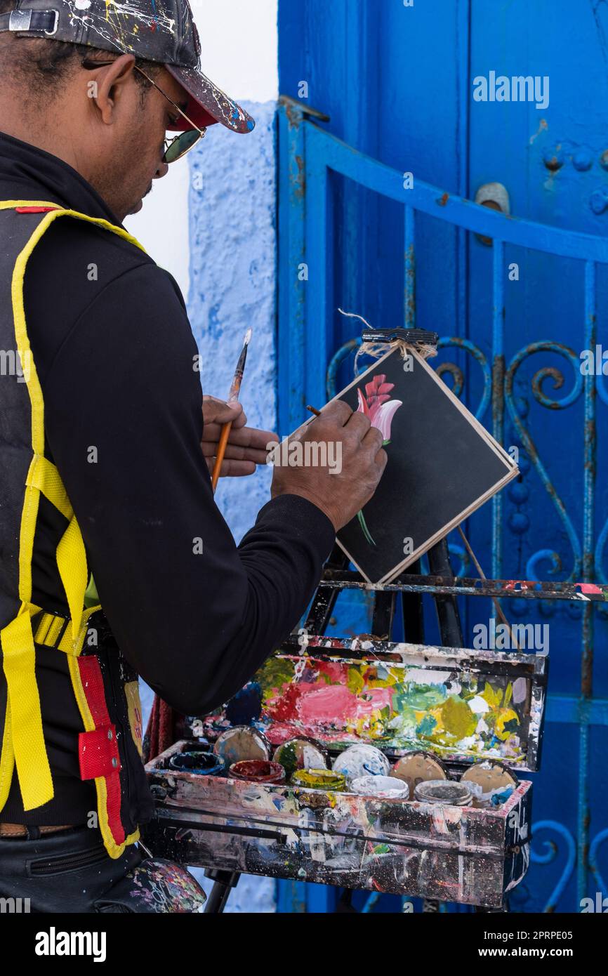 street painter with brush and paint, Asilah, morocco, africa Stock ...