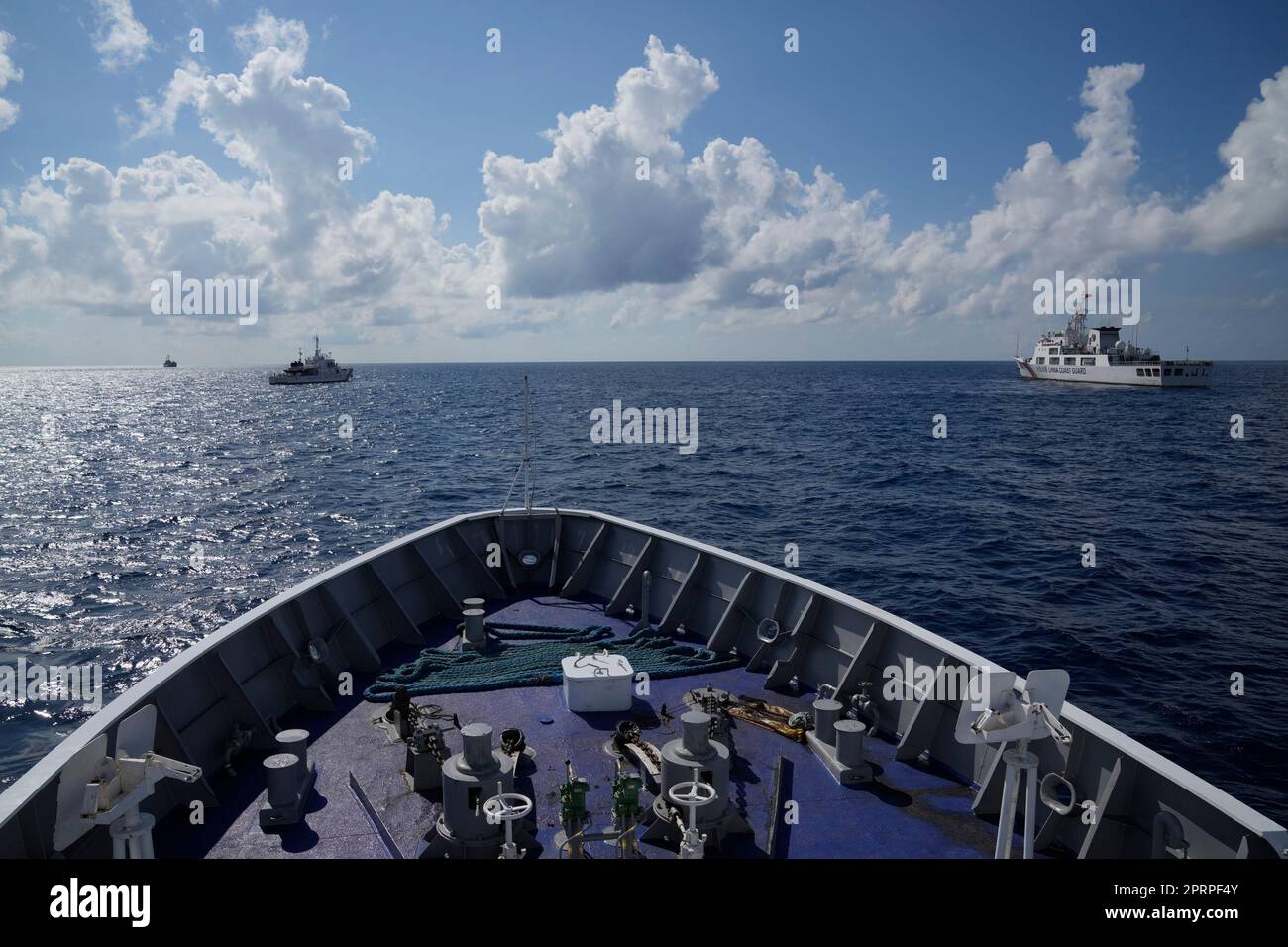 A Chinese Coast Guard ship, right, with bow number 5201 shadows ...