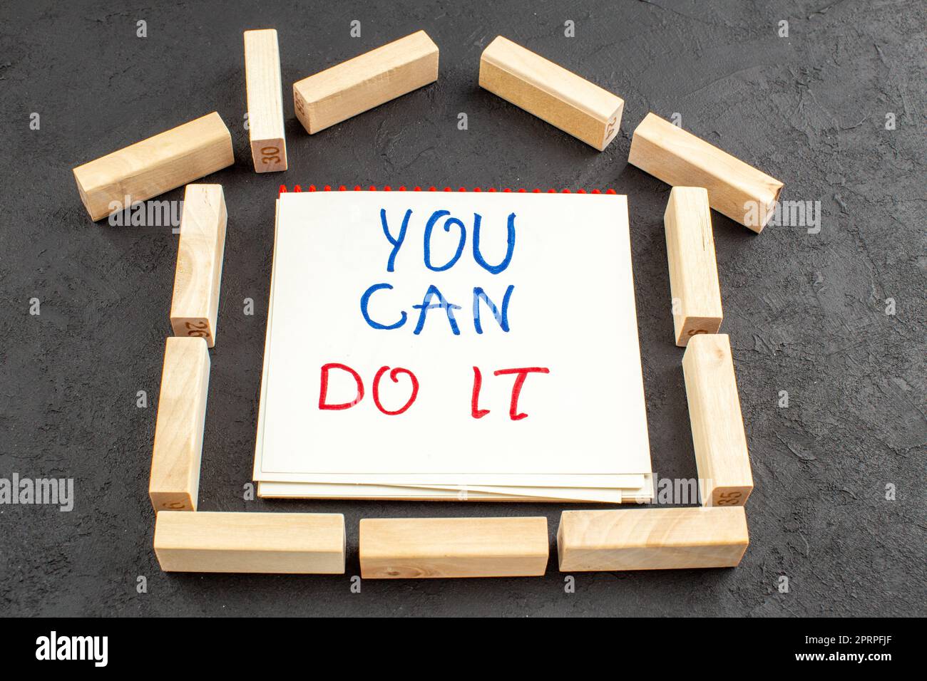 bottom view house shaped wood blocks you can do it written on notebook ...