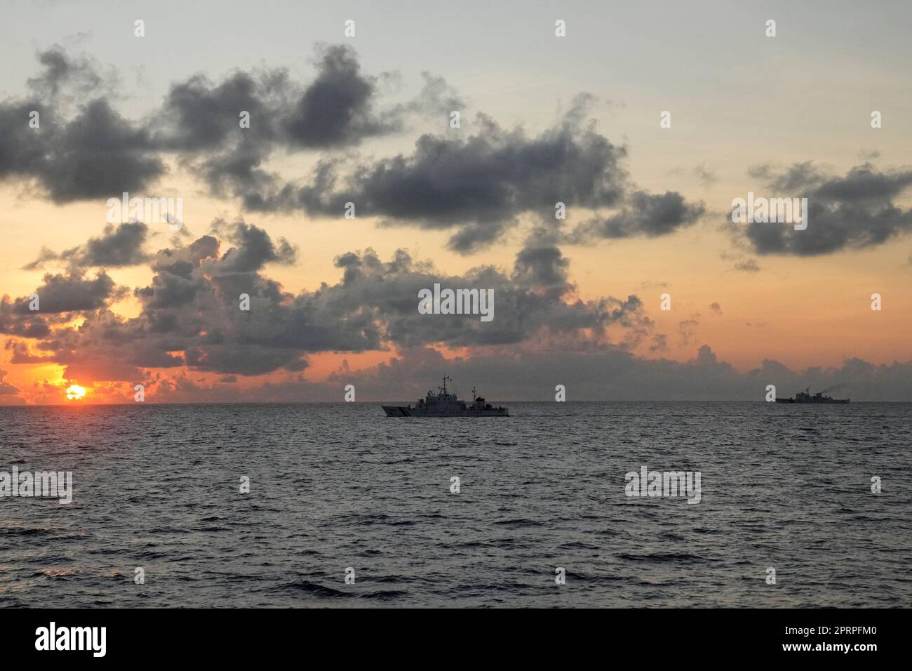 Philippine Coast Guard patrol vessel BRP Malapascua is followed closely ...