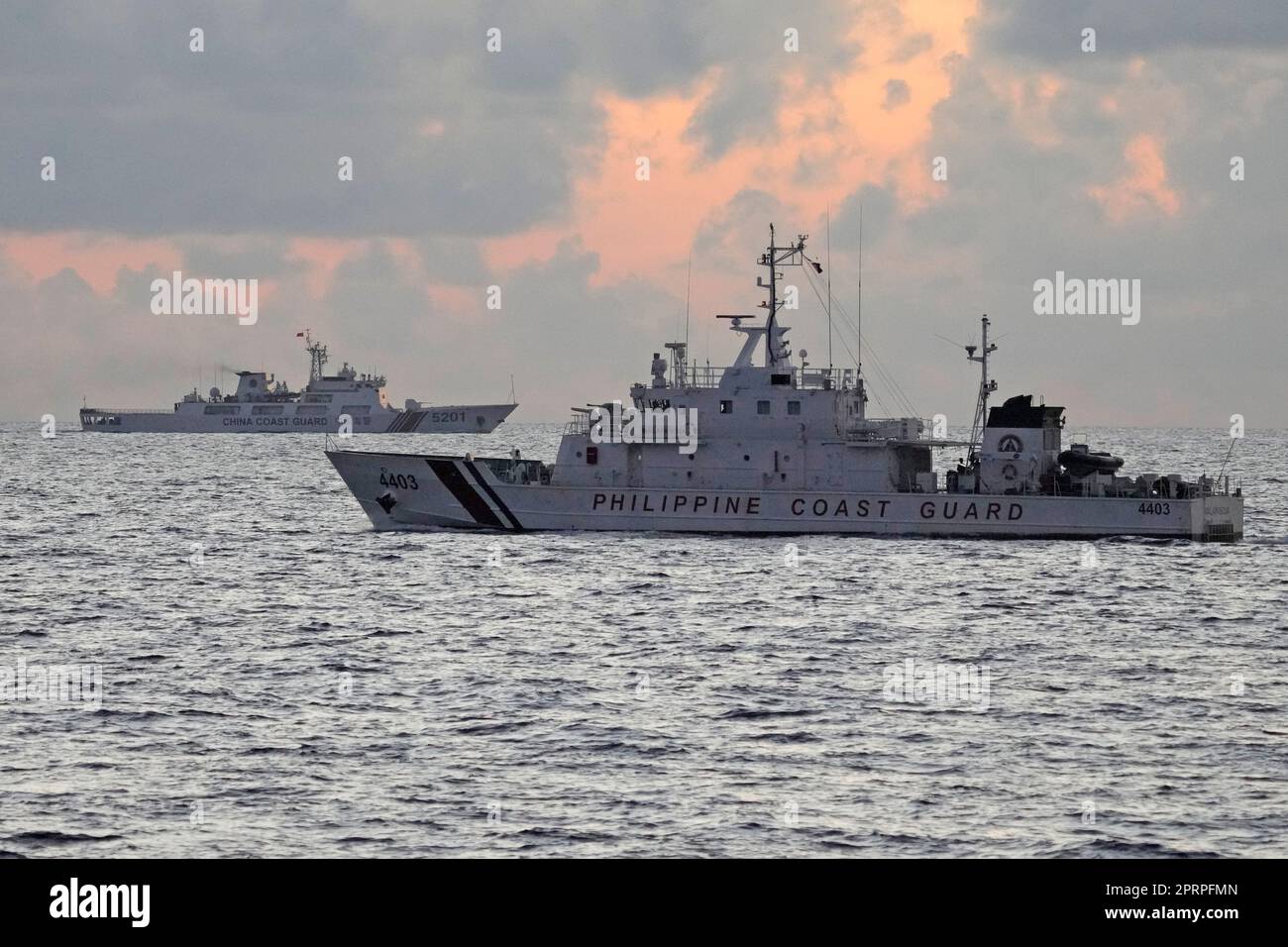 Philippine Coast Guard patrol vessel BRP Malapascua, right, passes by ...