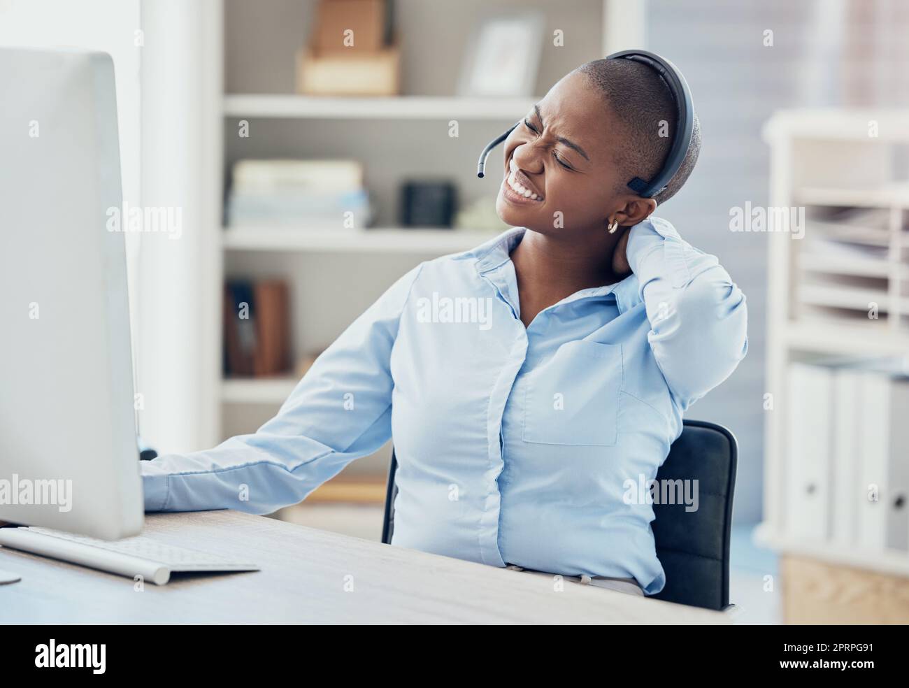 Black woman, neck pain and call center agent on office computer in crm ...
