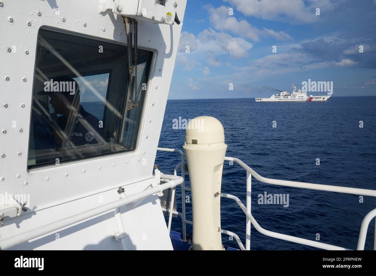 A Chinese Coast Guard ship with bow number 5201 runs beside Philippine ...
