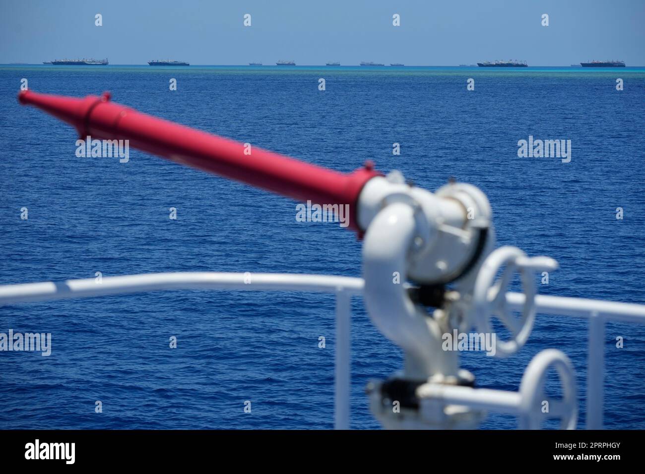 A Philippine Coast Guard ship approaches some of the many suspected ...