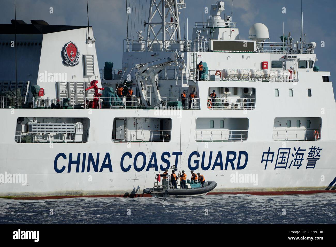 A Chinese Coast Guard ship with bow number 5201 deploys its crew on ...