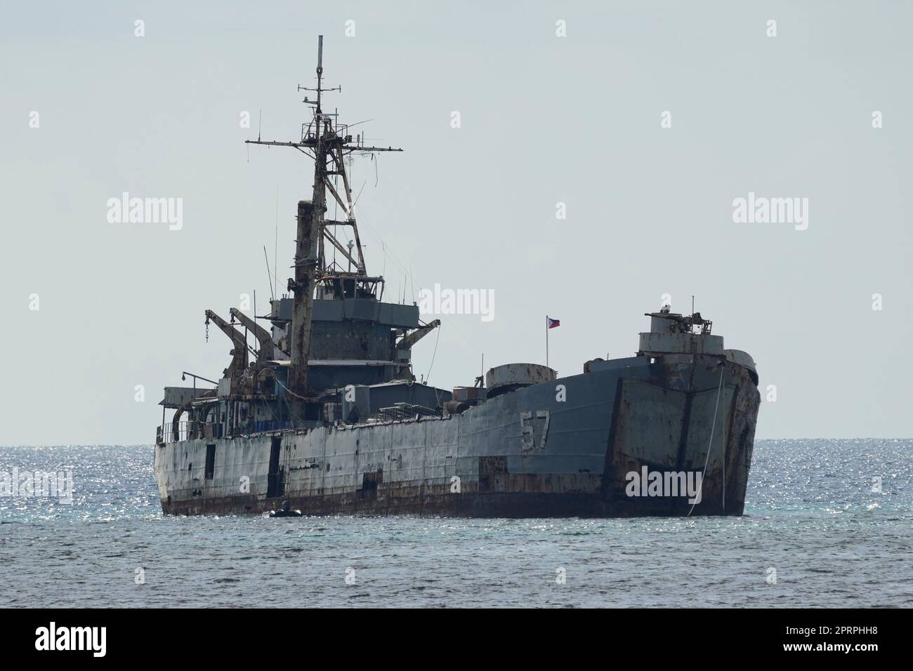 A Philippine flag is seen on the now crumbling Philippine navy ship BRP ...