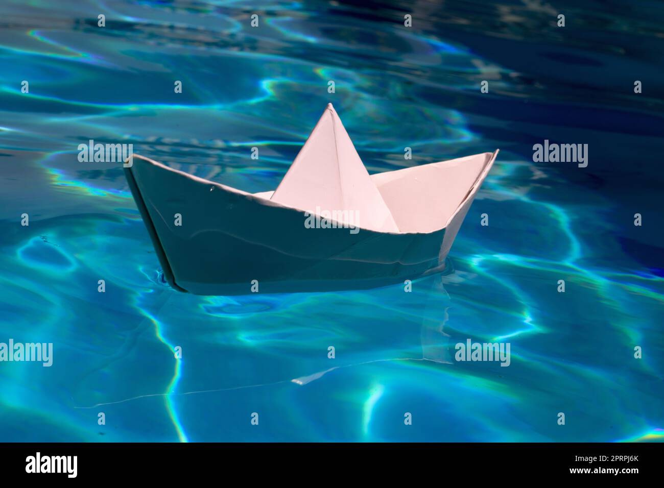 Paper ship sail. Paper boat on the sea water background. Dreaming ...