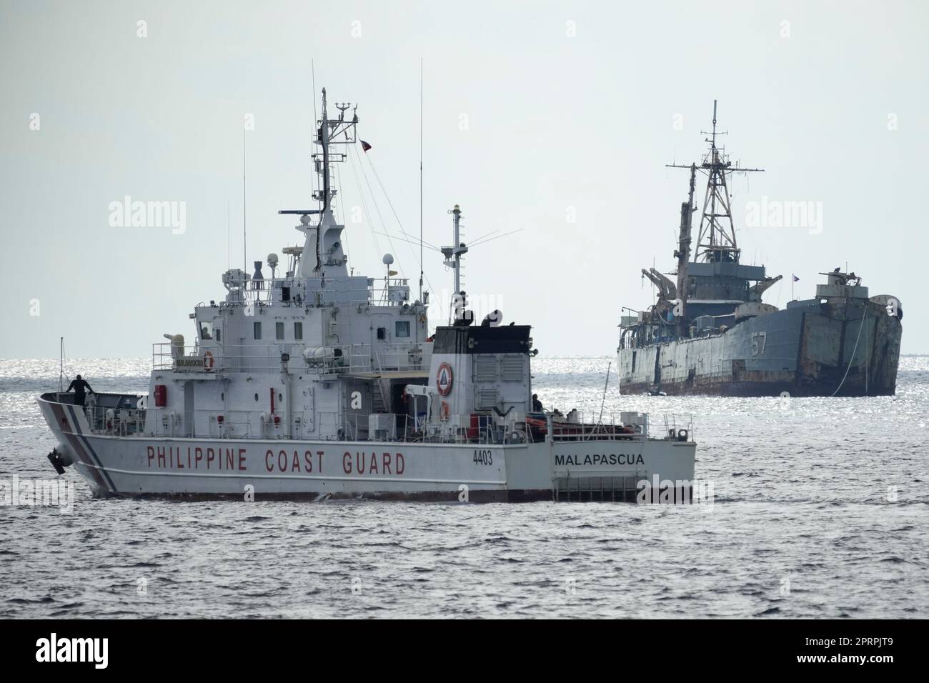 Philippine Coast Guard patrol vessel BRP Malapascua, left, goes near ...