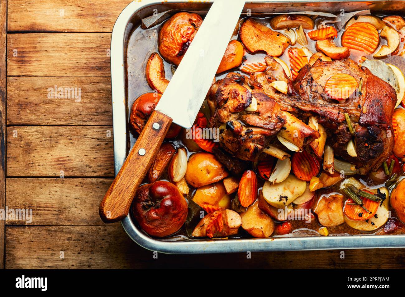 Baked meat with autumn fruits Stock Photo - Alamy