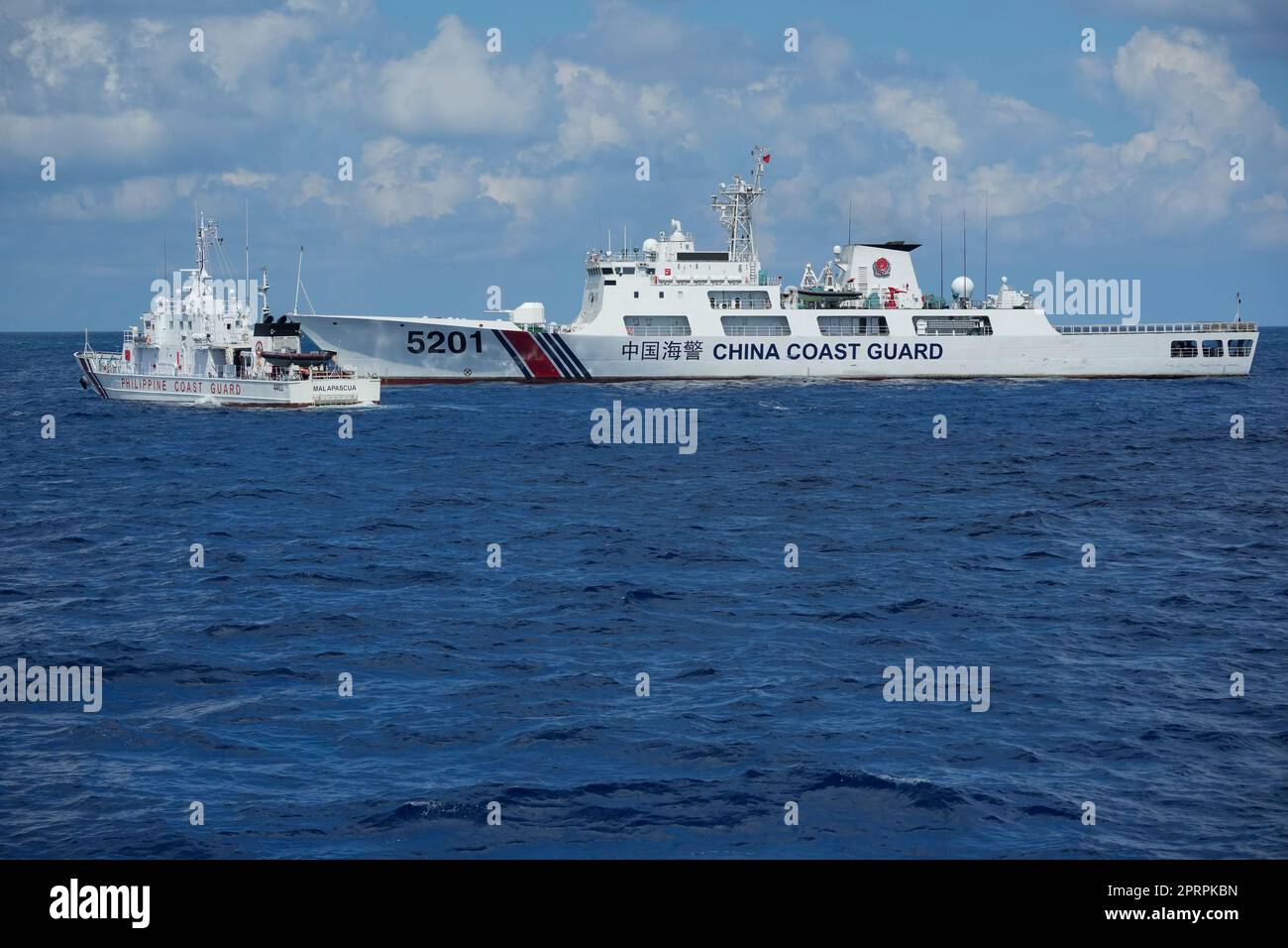 A Philippine Coast Guard ship BRP Malapascua, left, maneuvers out of ...
